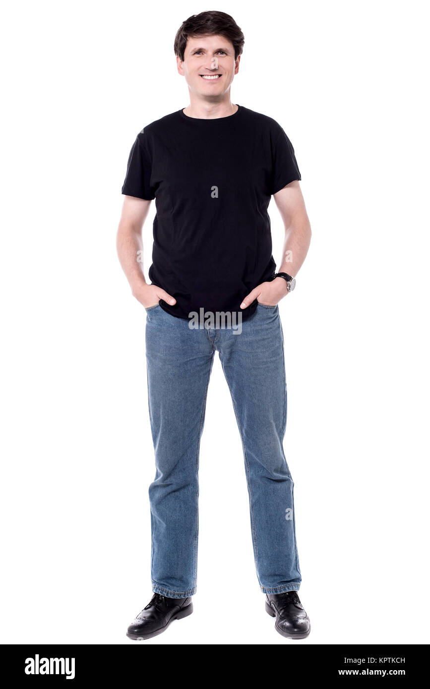 Casual man with hands in pockets Stock Photo - Alamy