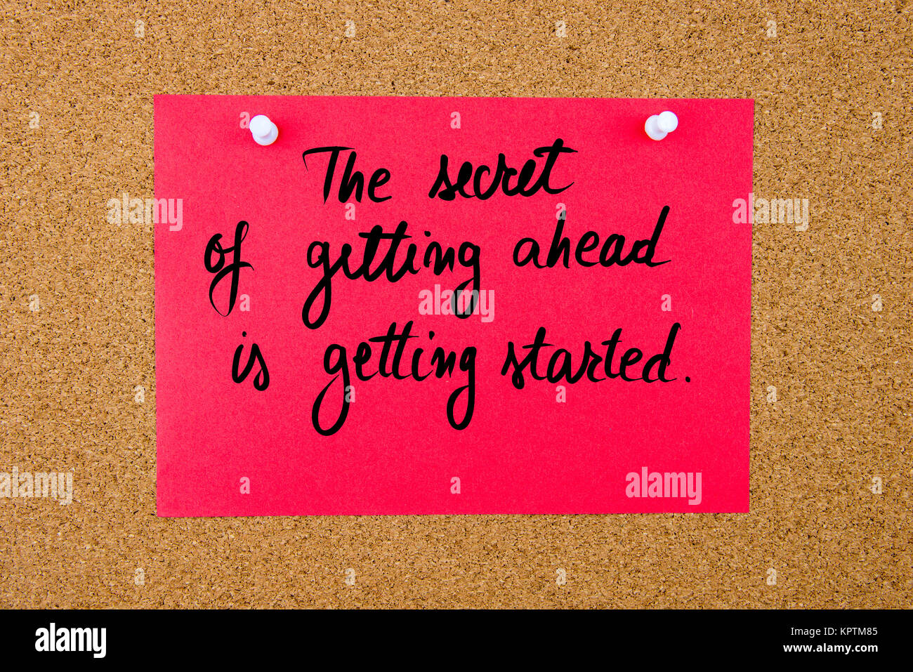 Red paper note with handwritten text on cork board Stock Photo - Alamy