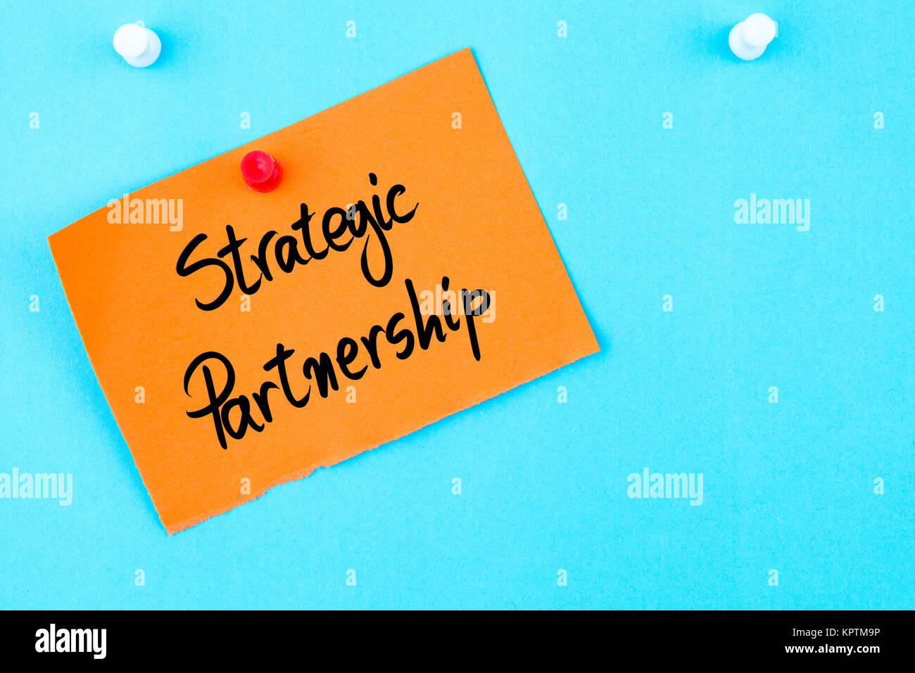 Strategic Partnership written on orange paper note Stock Photo - Alamy