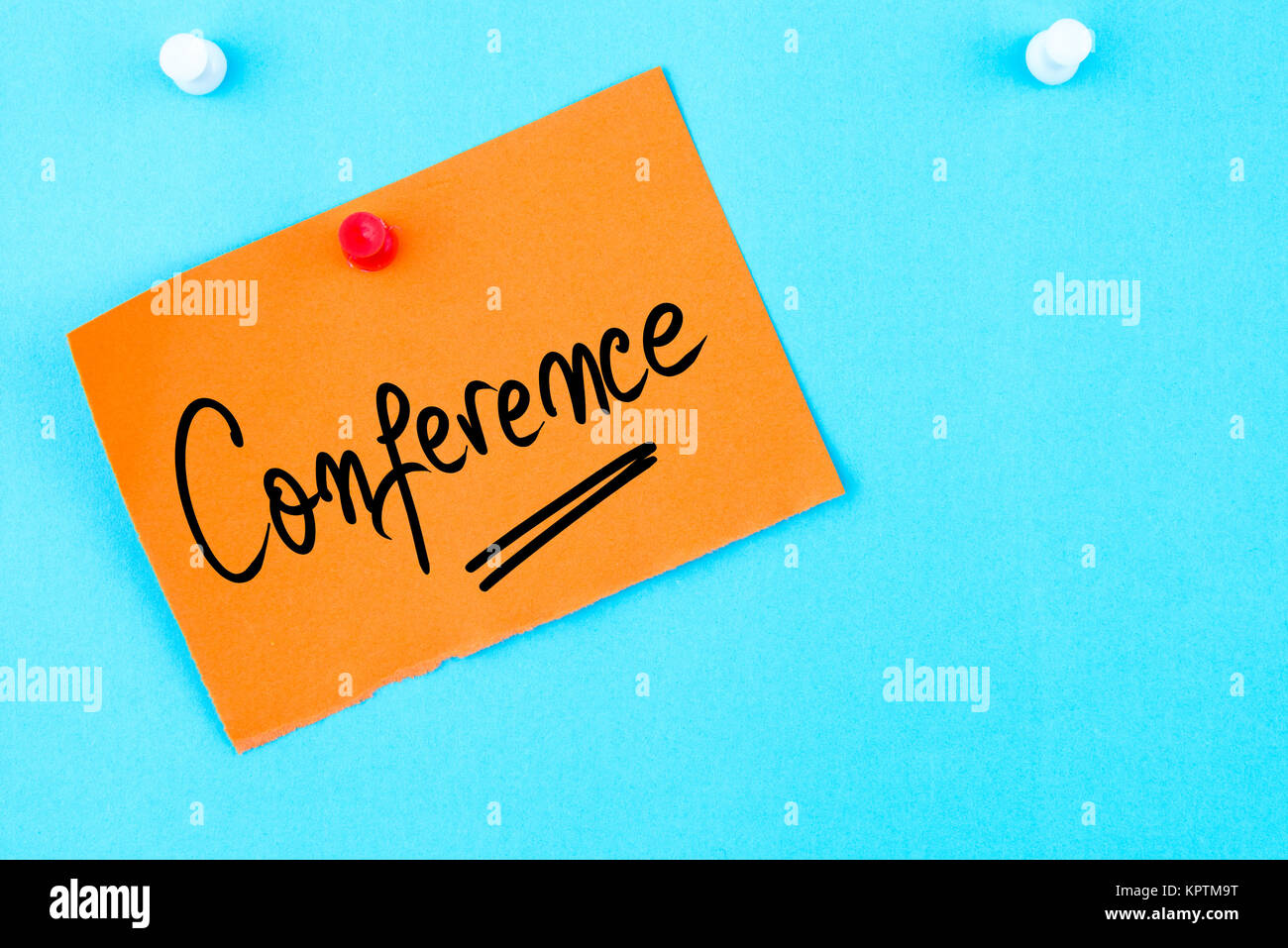 Conference written on orange paper note Stock Photo - Alamy