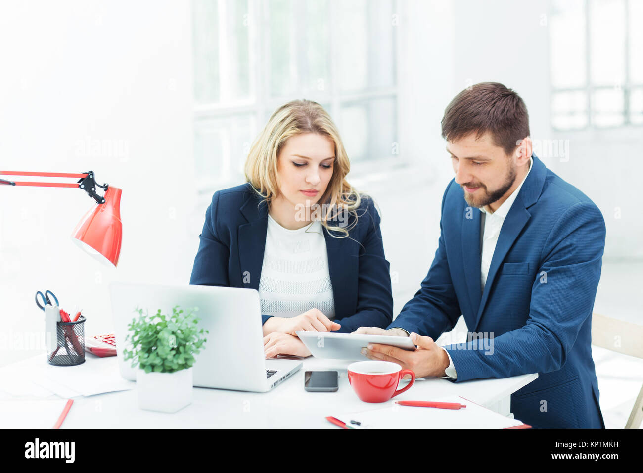 Male and female office workers Stock Photo - Alamy