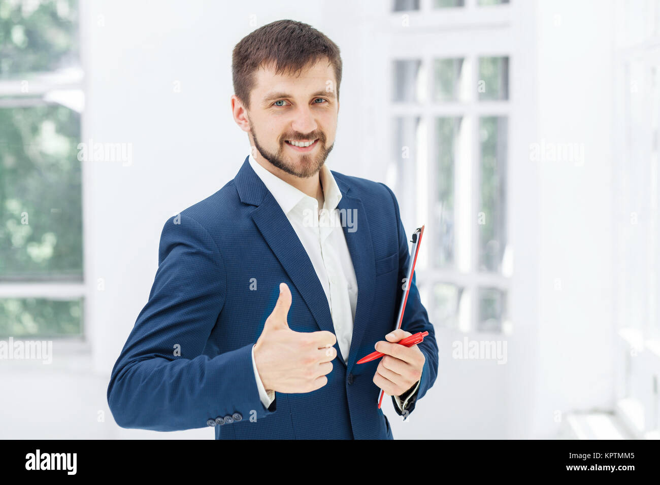 The smiling male office worker Stock Photo - Alamy
