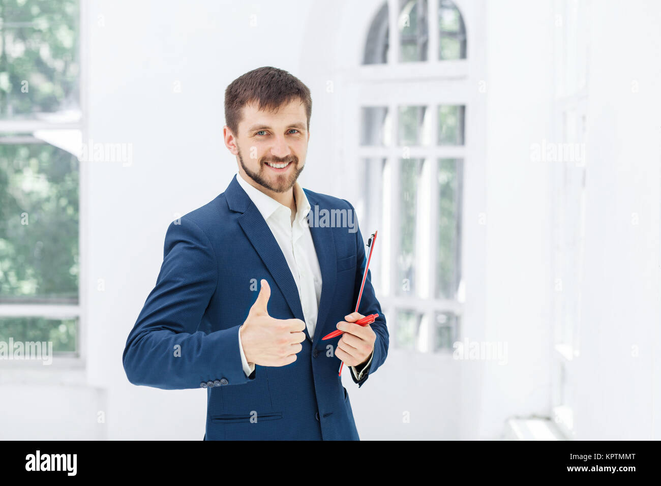 The smiling male office worker Stock Photo - Alamy