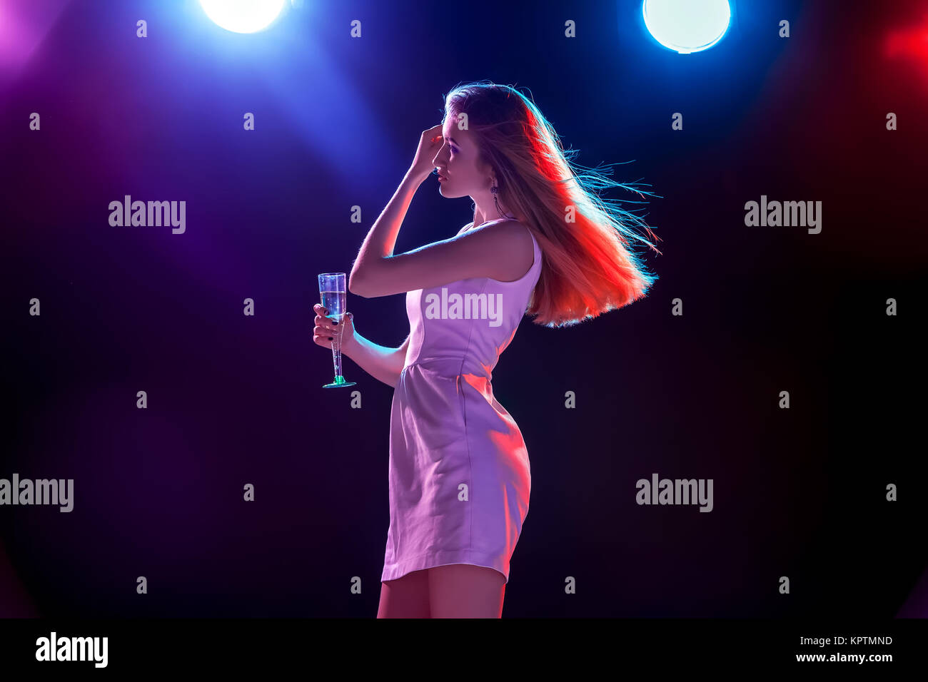 The beautiful girl dancing at the party drinking champagne Stock Photo ...