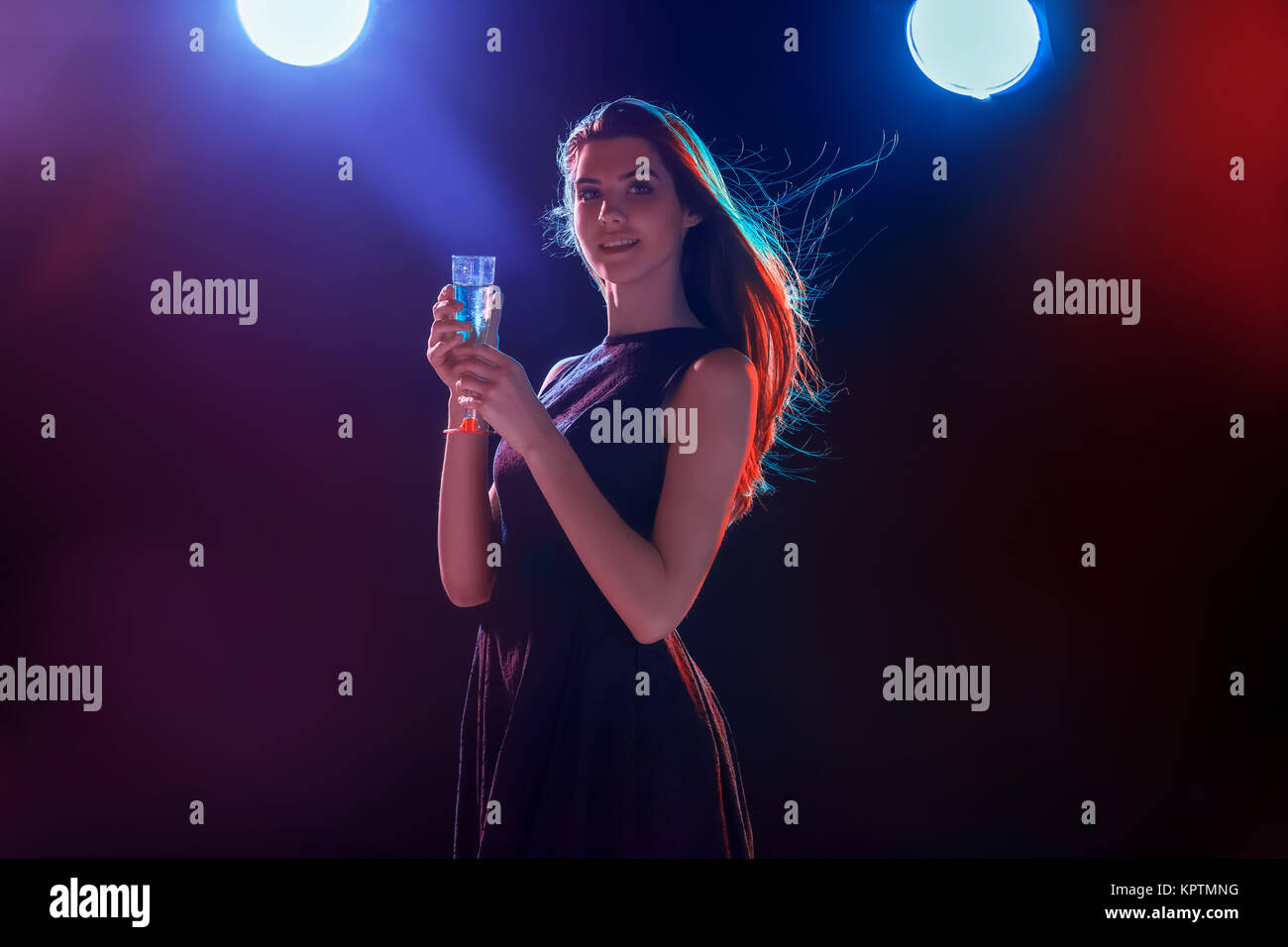 The beautiful girl dancing at the party drinking champagne Stock Photo ...