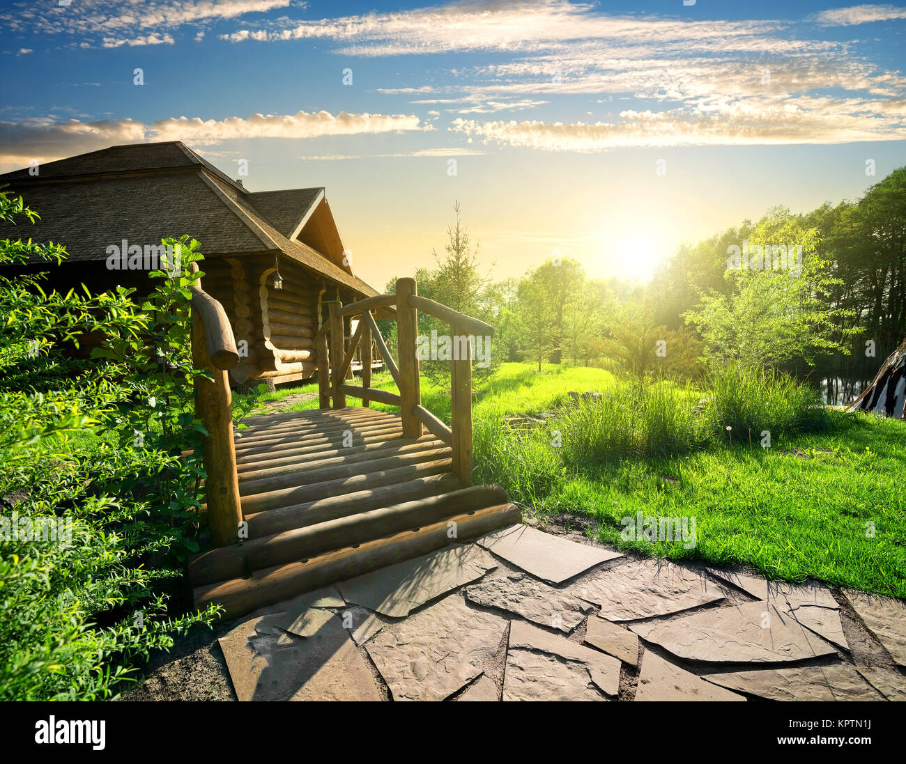 Sunny sunset and house Stock Photo - Alamy