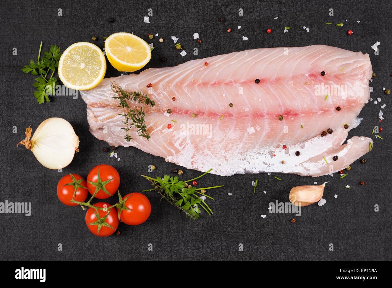 Luxurious perch fillet on black background, top view. Culinary fish ...