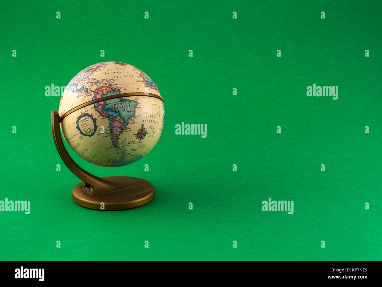 Little globe on colored background Stock Photo - Alamy