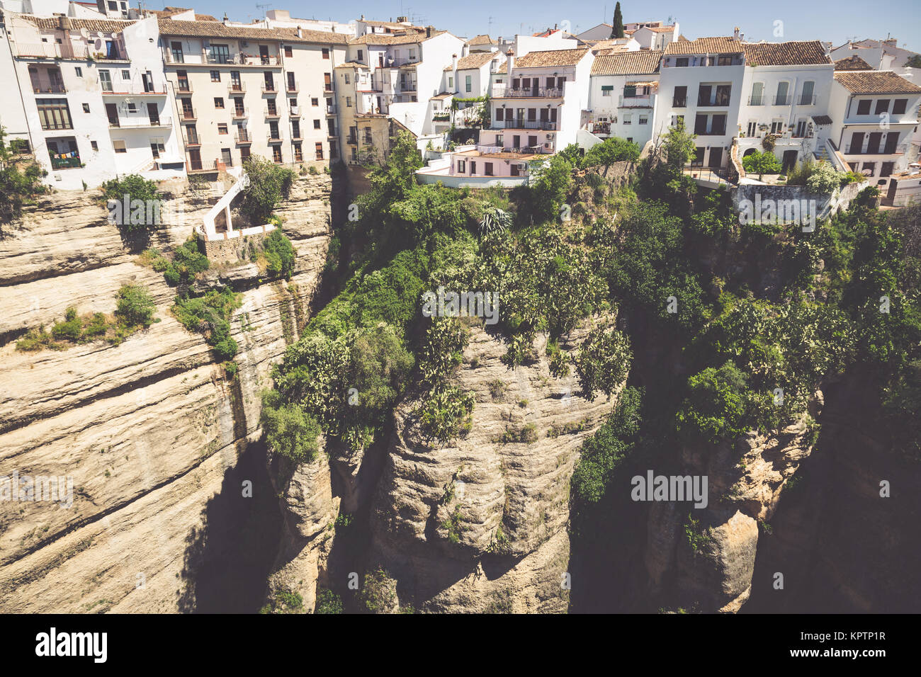 view of buildings over cliff in ronda, spain Stock Photo - Alamy