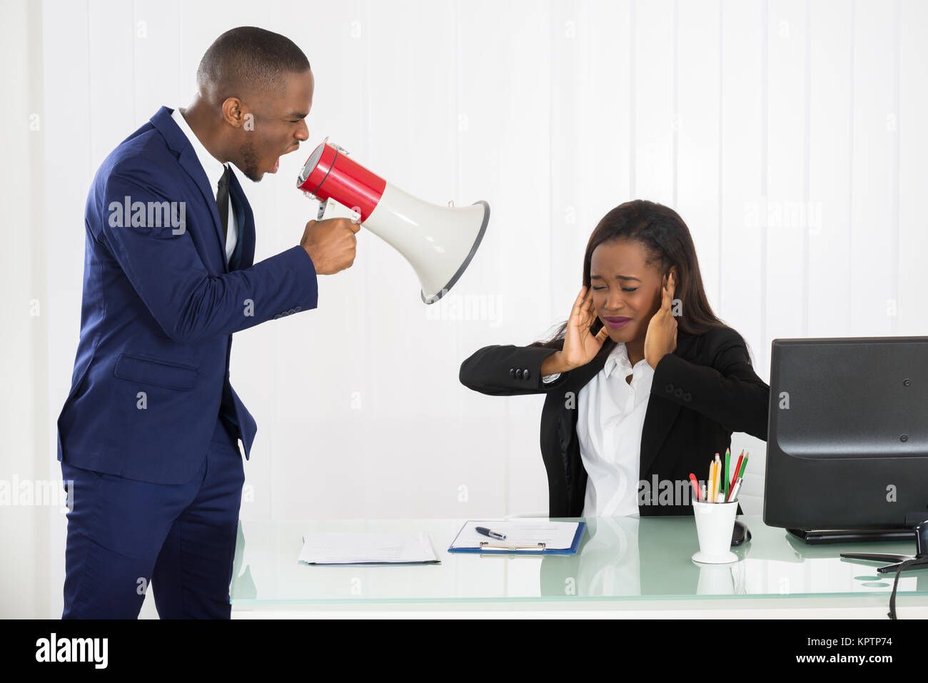 Boss Shouting At Young Businesswoman Through Loudspeaker In Office ...