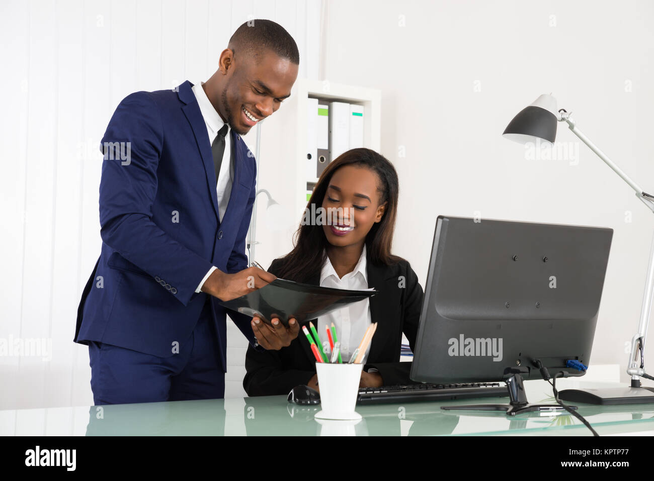 Young African Businesspeople Working On Computer At Office Stock Photo ...