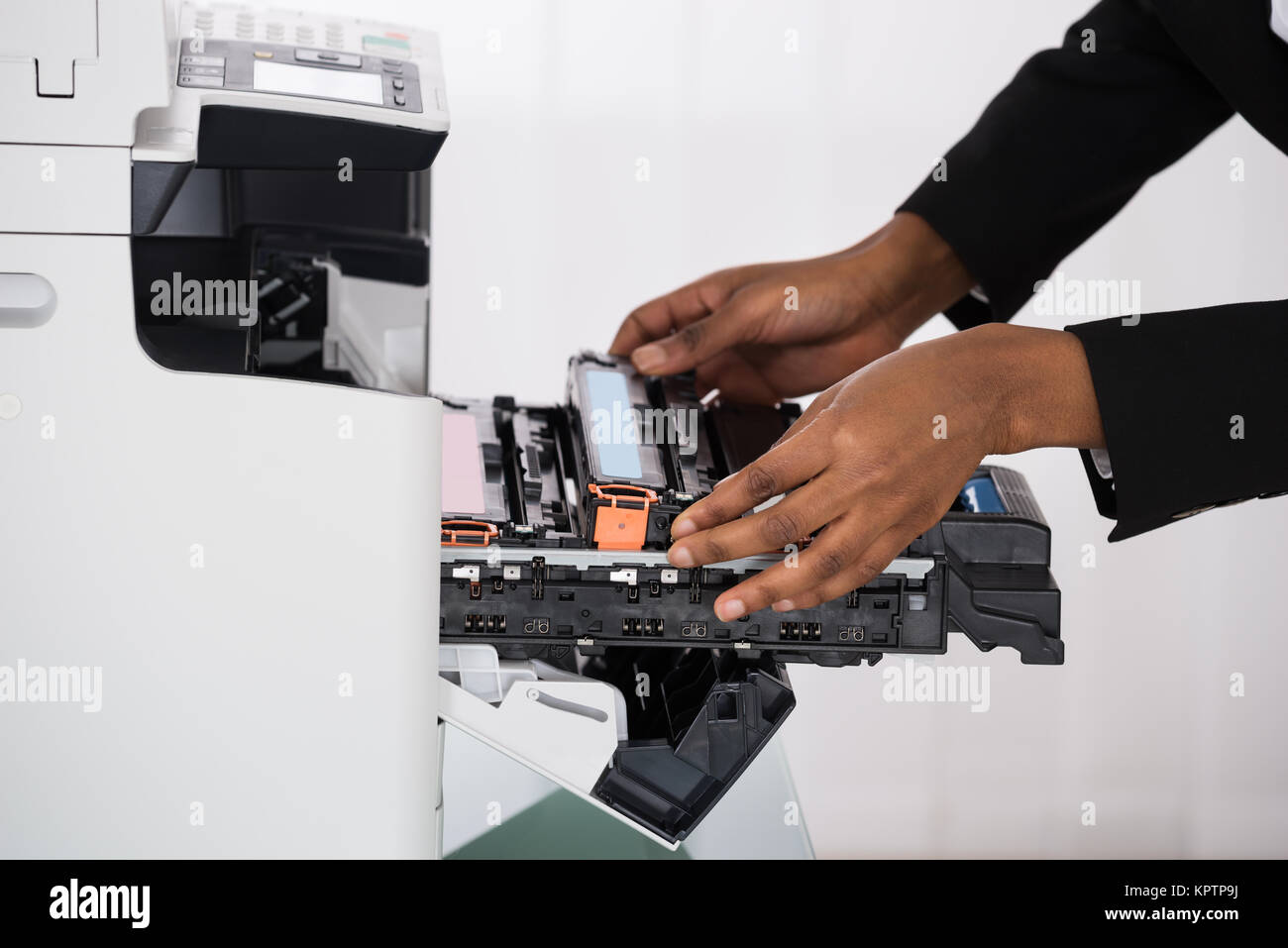 Close-up Of African Businesswoman Hand Fixing Photocopy Machine In ...