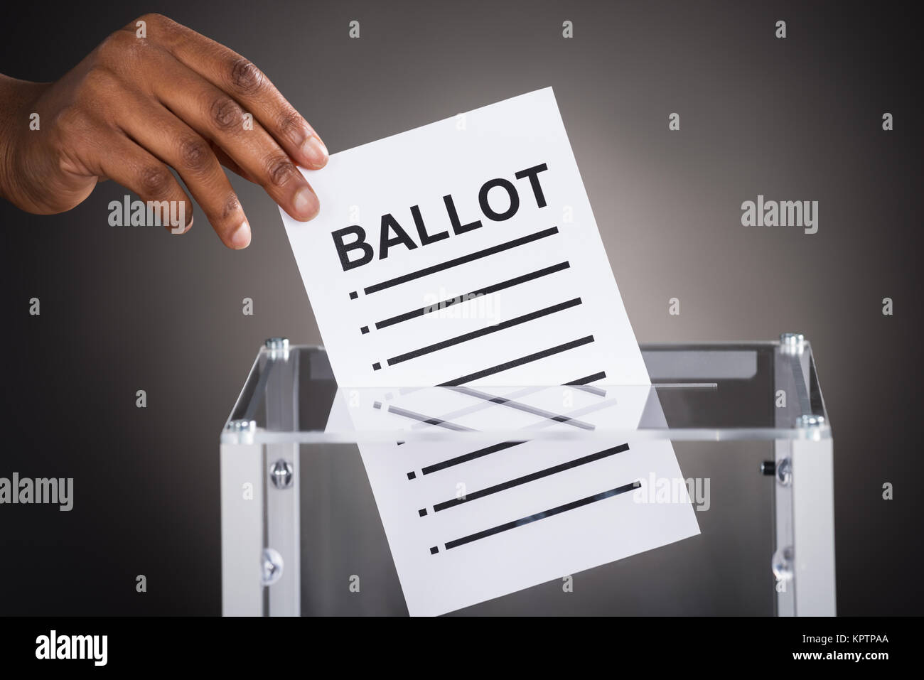 Close-up Of A Person Hand Inserting Ballot In Glass Box Against Gray ...