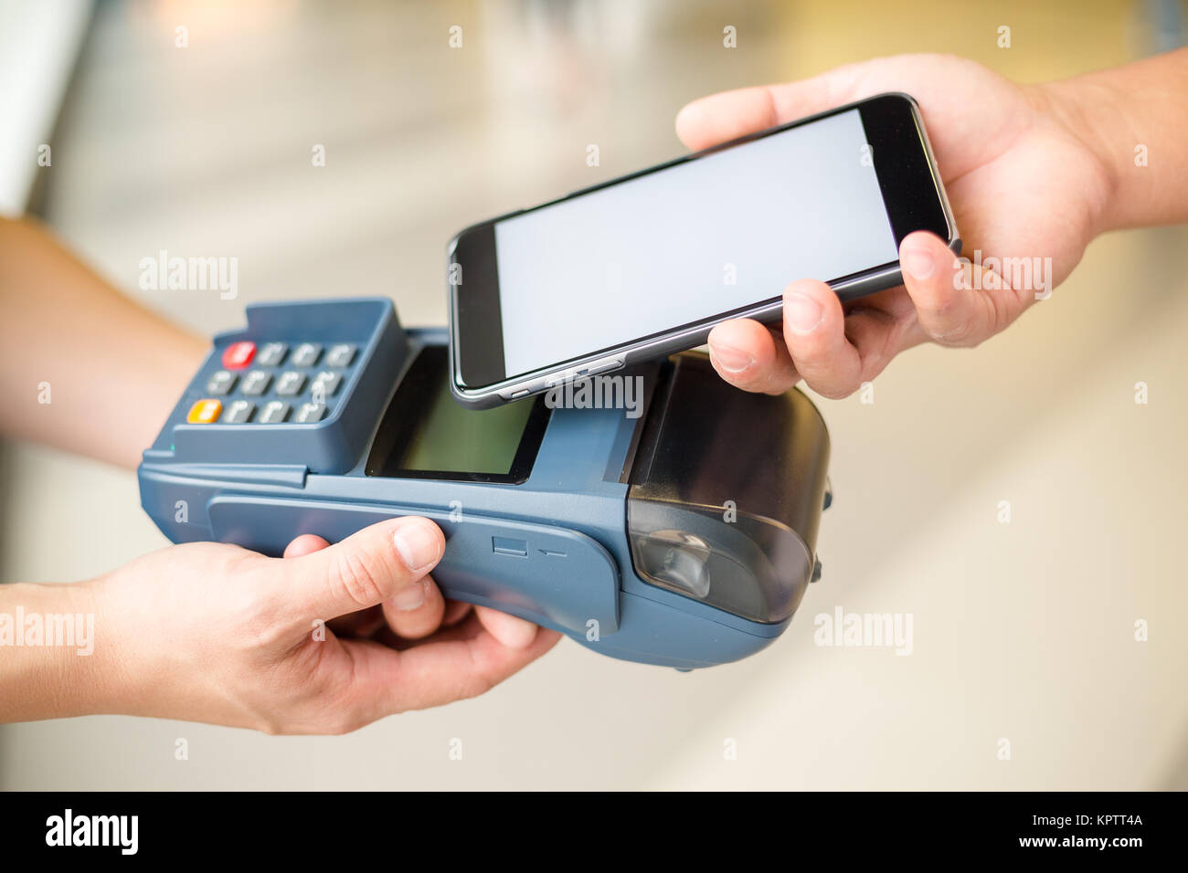 Customer pay by cellphone Stock Photo - Alamy