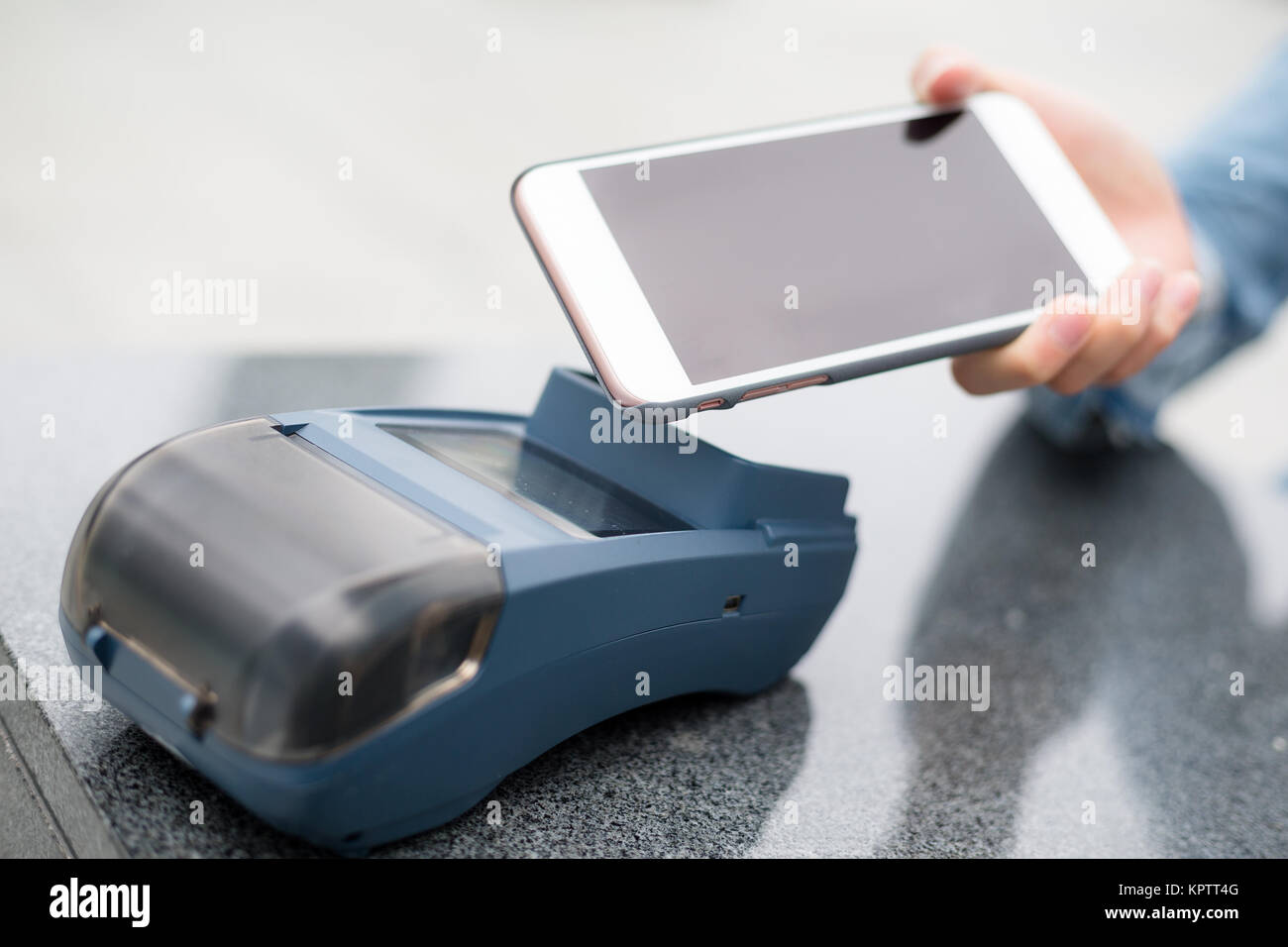 Customer using cellphone to pay Stock Photo - Alamy