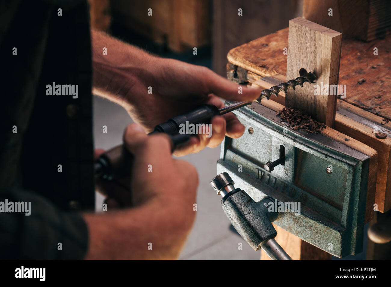 Carpenter hand drilling wood Stock Photo - Alamy