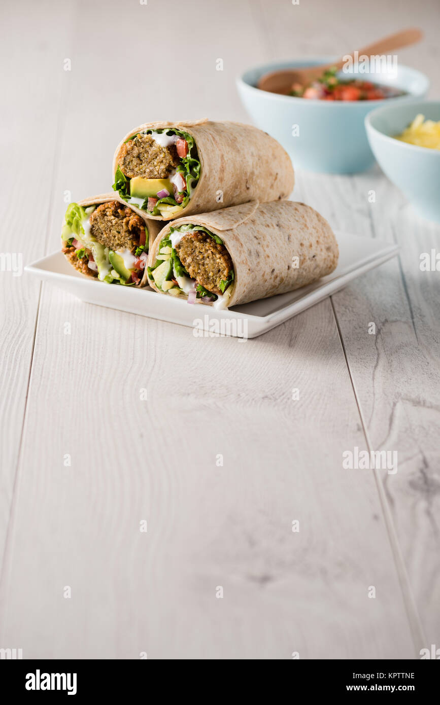 Vegetarian falafel wraps with avocado and cheese Stock Photo - Alamy