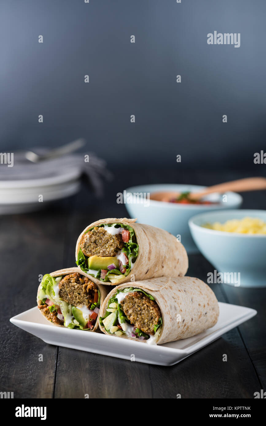 Vegetarian falafel wraps with avocado and cheese Stock Photo - Alamy