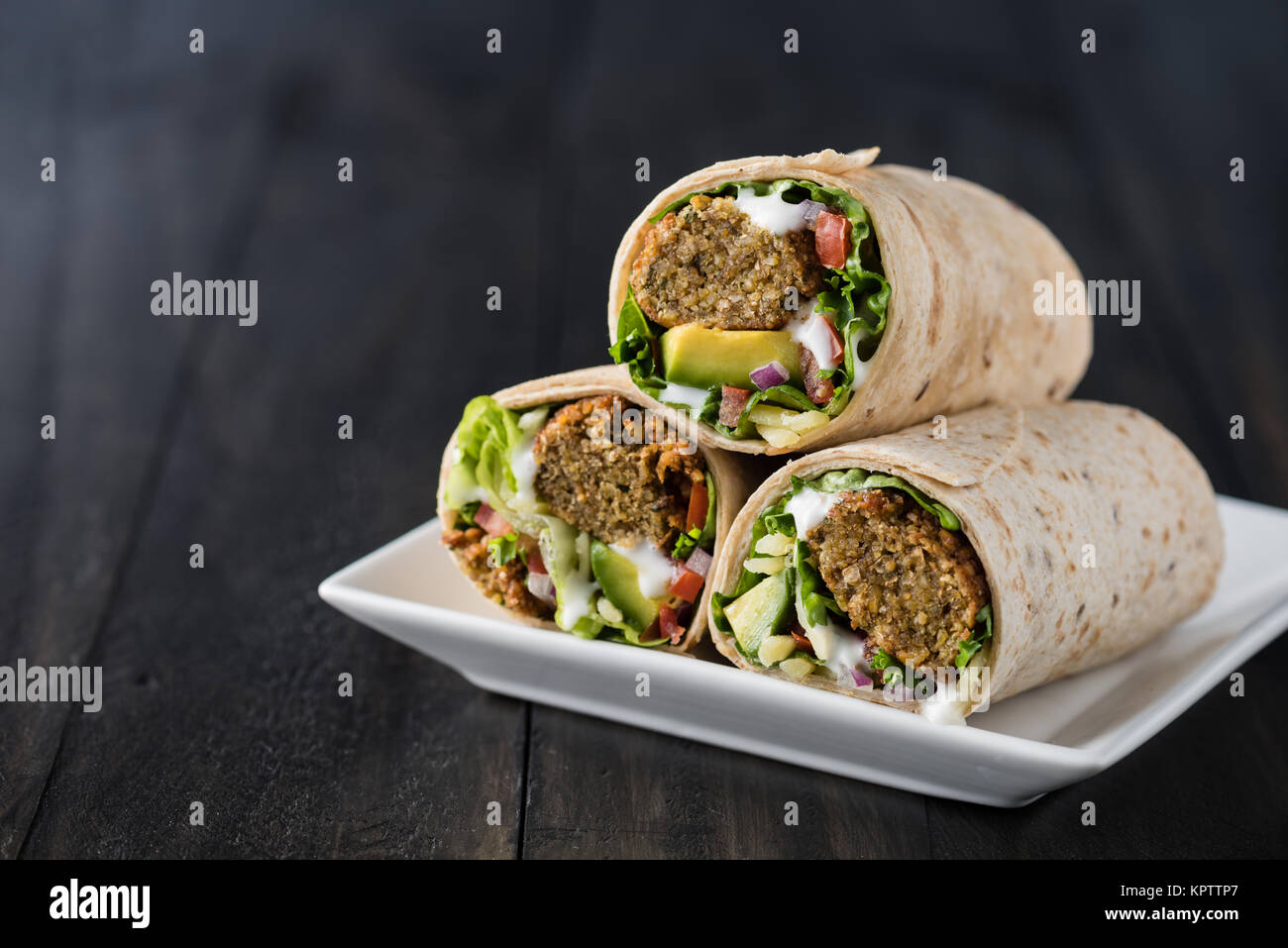 Vegetarian falafel wraps with avocado and cheese Stock Photo - Alamy