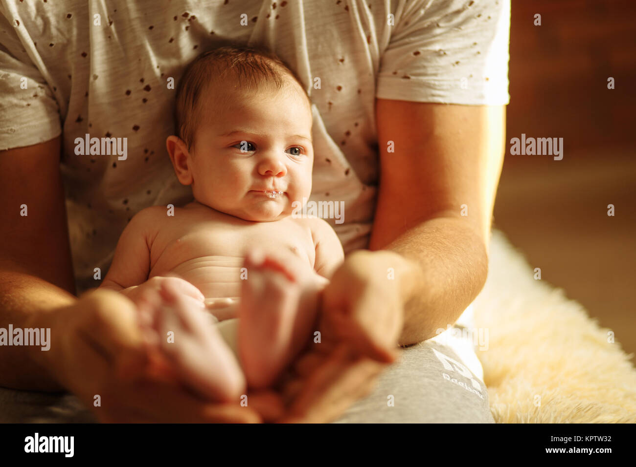 newborn baby legs in mothers lovely hand with soft focus on babie's ...