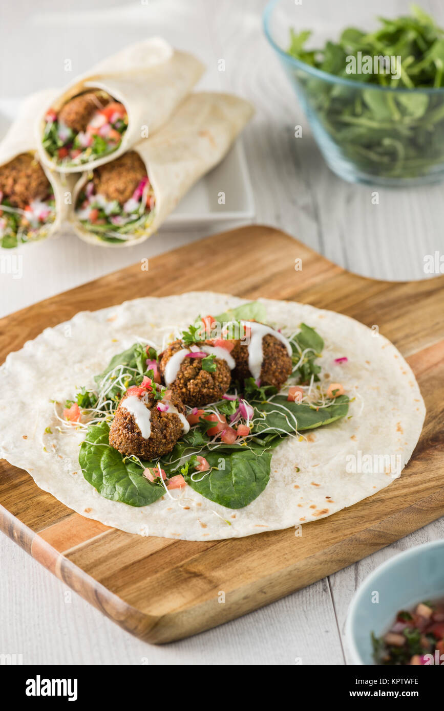 Vegan Falafel Wrap With Salsa and salad Stock Photo - Alamy