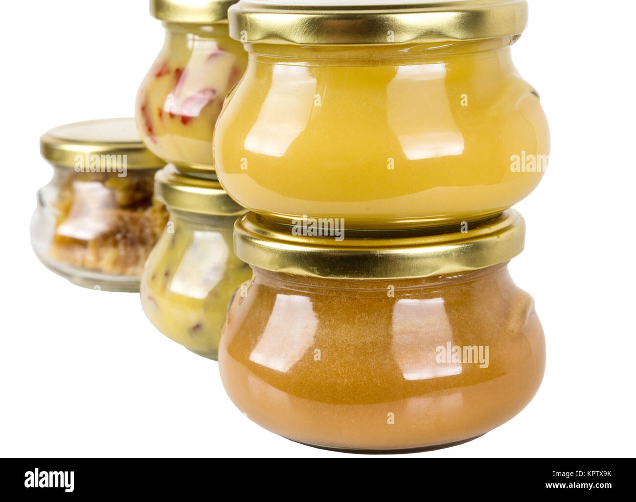 five closed cans with different honey Stock Photo - Alamy