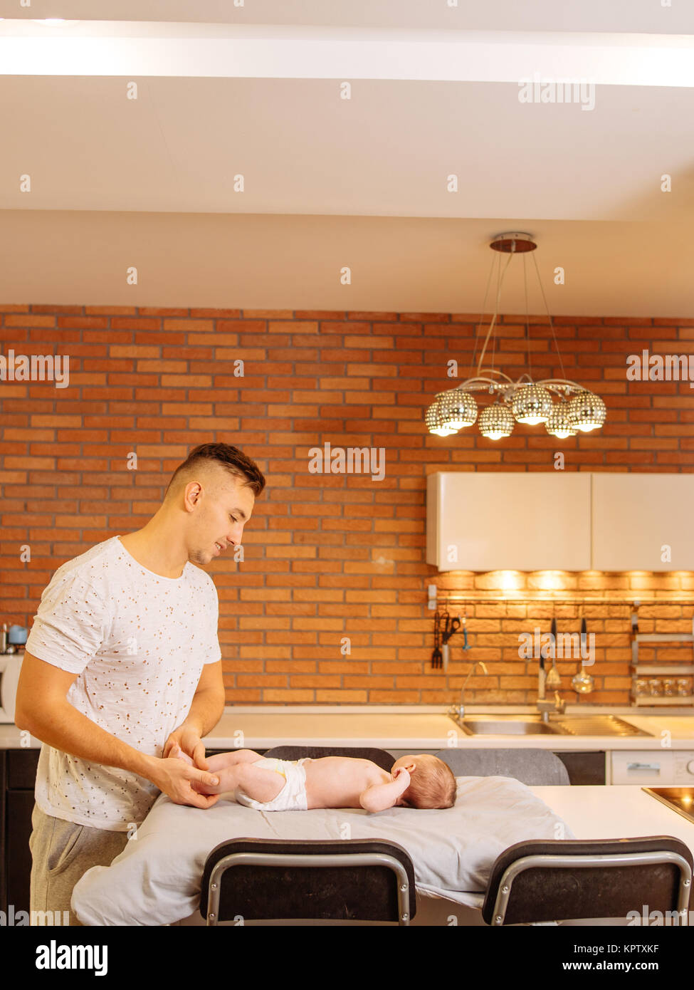 Man changing nappy hi-res stock photography and images - Alamy
