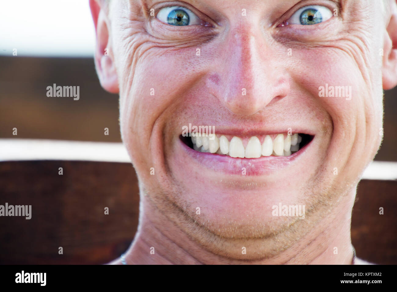Close up portrait of funny man, grins his teeth Stock Photo - Alamy