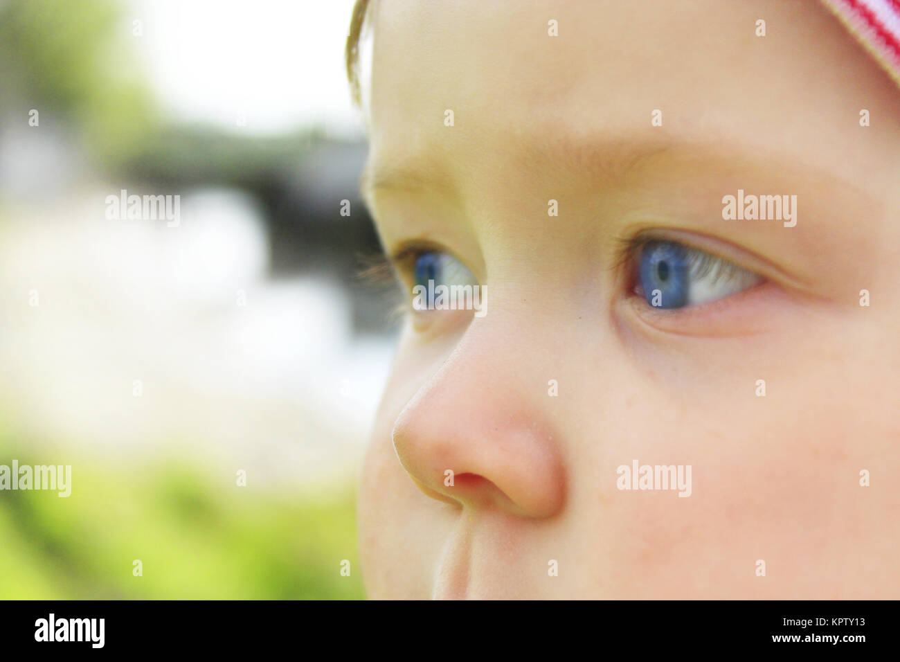 face of the baby girl with intent sight Stock Photo - Alamy