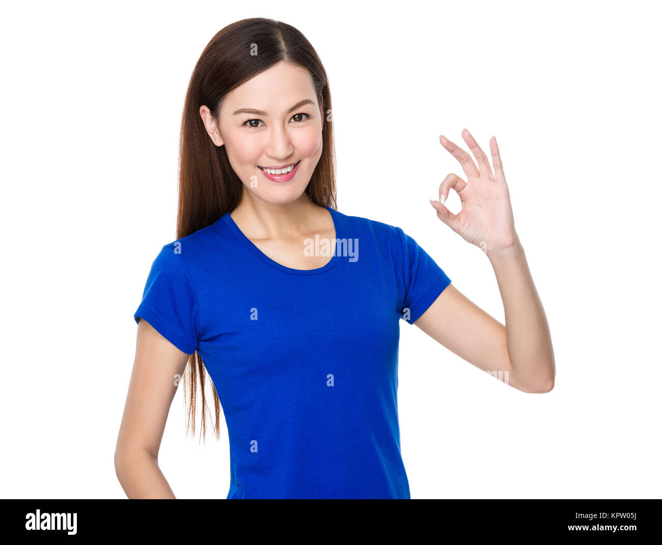 Young woman showing ok sign gesture Stock Photo - Alamy