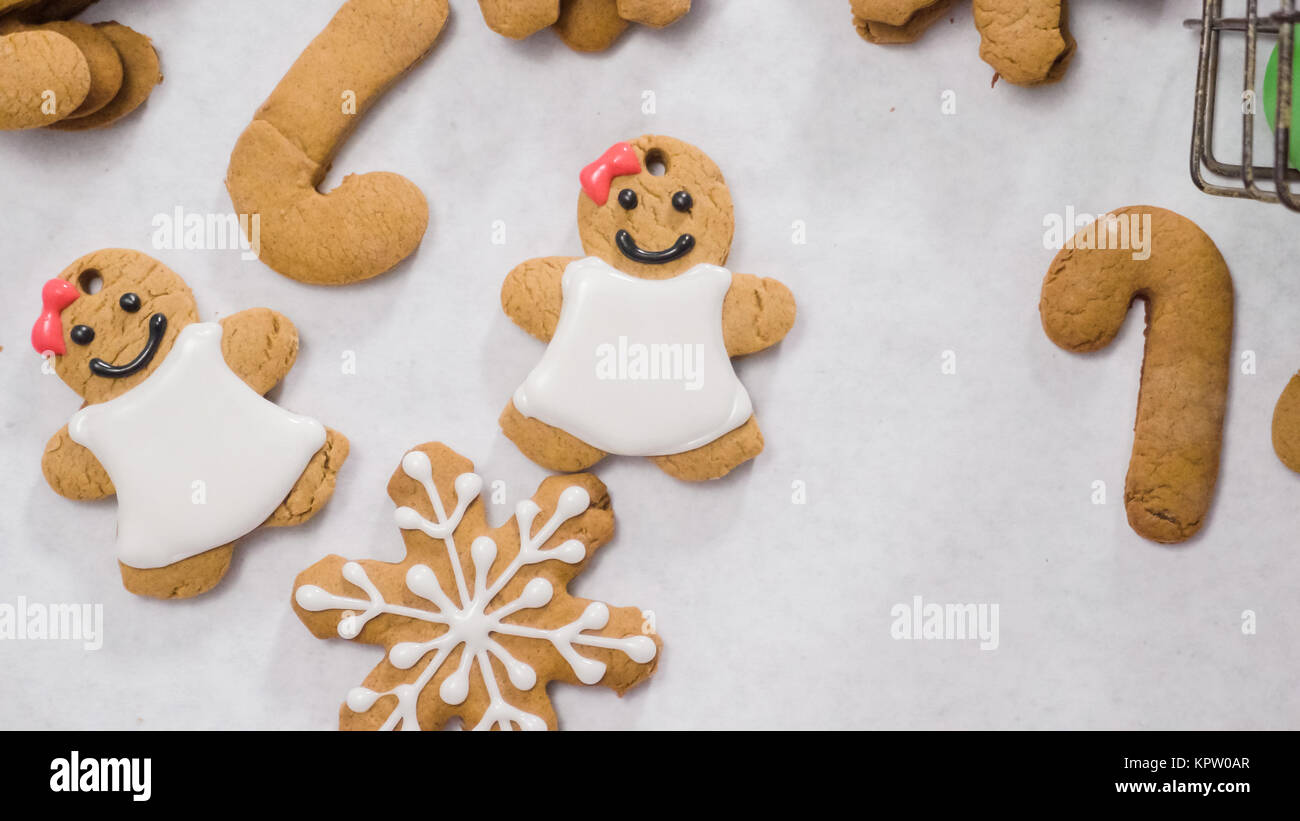 Decorating gingerbread cookies with royal icing for Christmas Stock ...