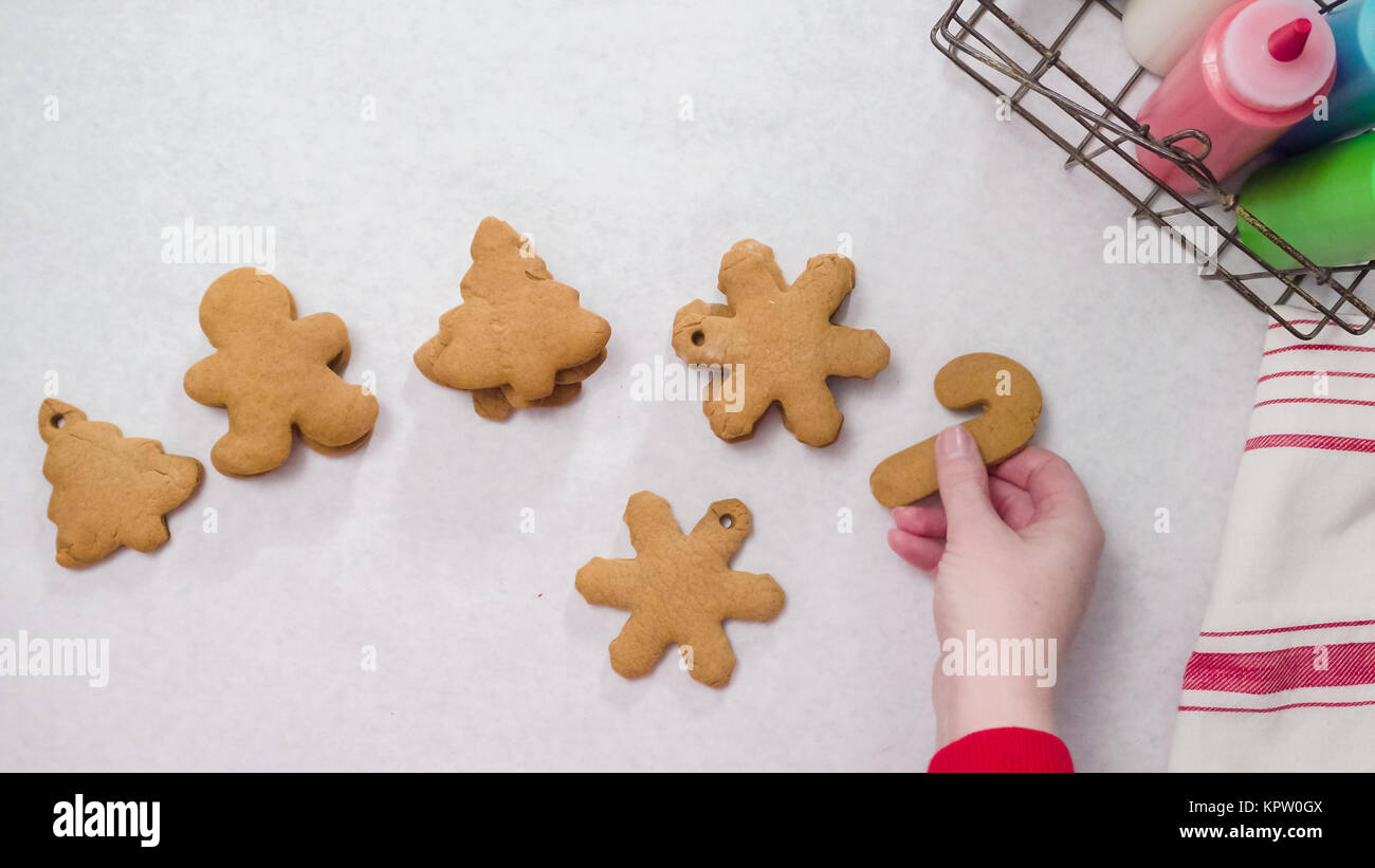 Decorating gingerbread cookies with royal icing for Christmas Stock ...