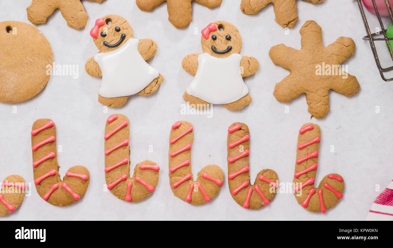 Decorating gingerbread cookies with royal icing for Christmas Stock ...