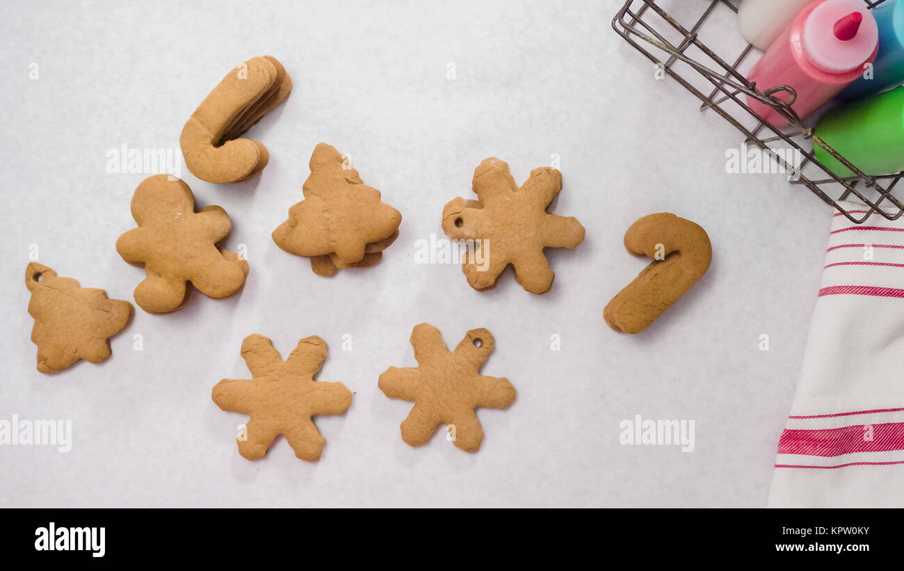 Decorating gingerbread cookies with royal icing for Christmas Stock ...