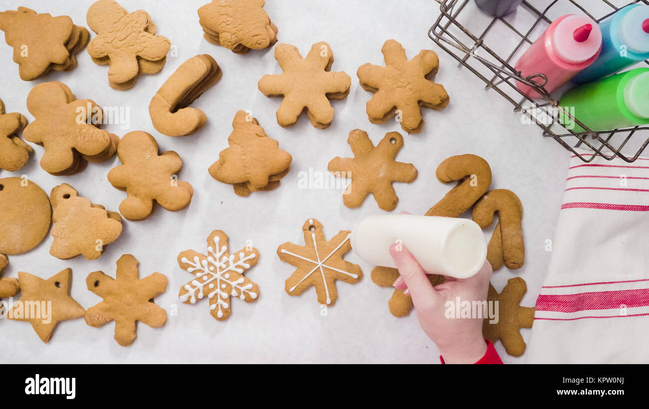 Decorating gingerbread cookies with royal icing for Christmas Stock ...