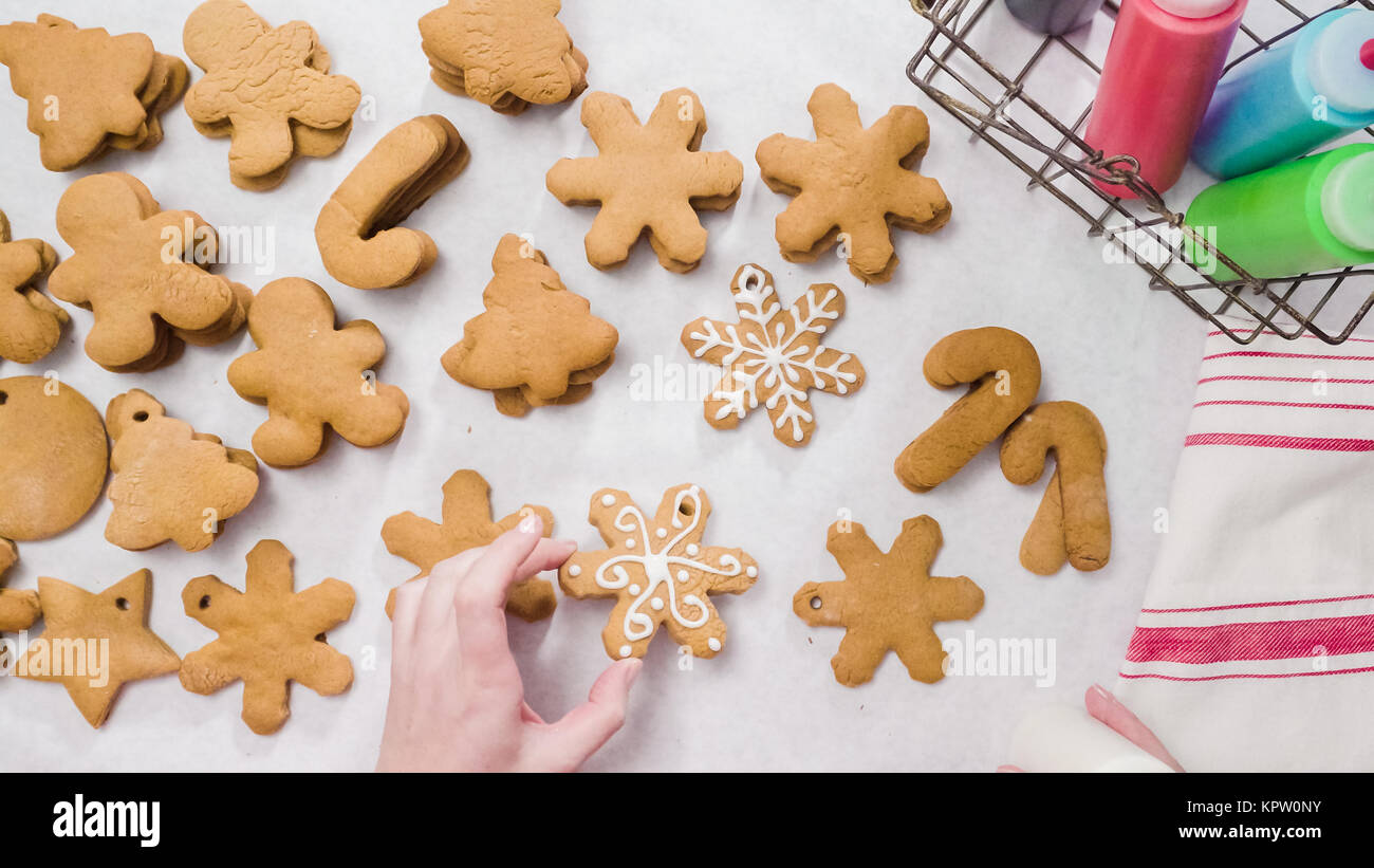 Decorating gingerbread cookies with royal icing for Christmas Stock ...