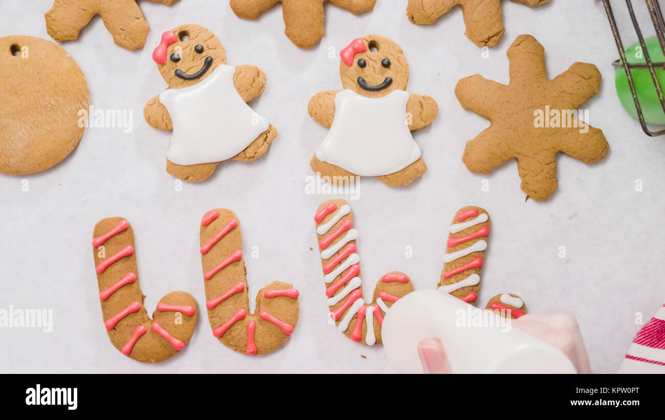 Decorating gingerbread cookies with royal icing for Christmas Stock ...
