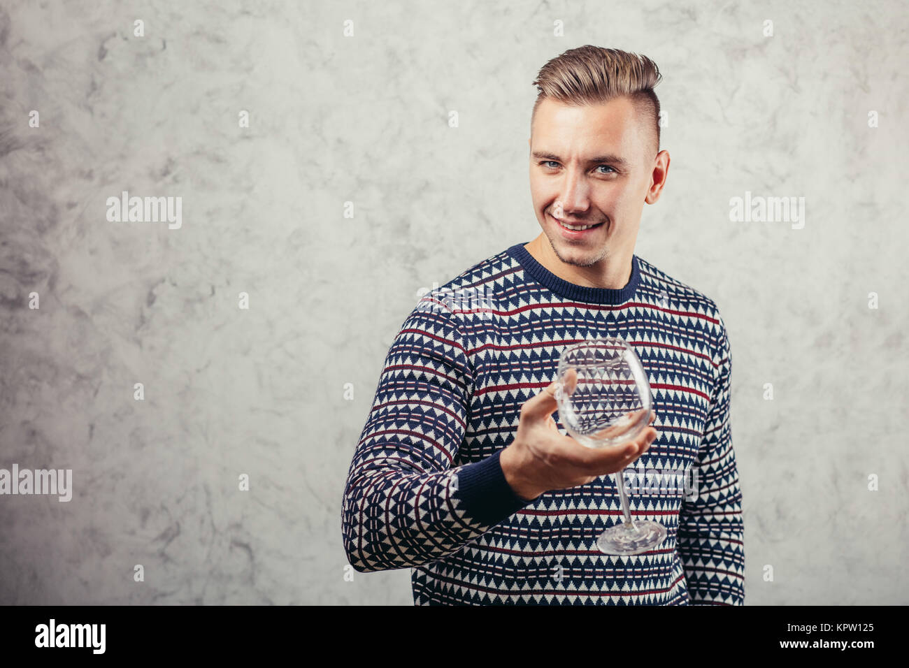 man holding empty wine glass Stock Photo - Alamy