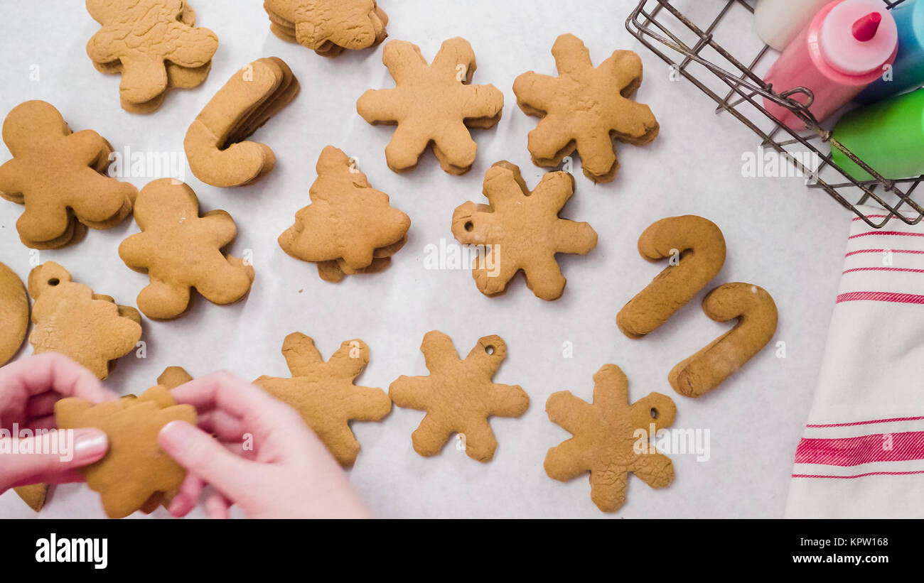 Decorating gingerbread cookies with royal icing for Christmas Stock ...