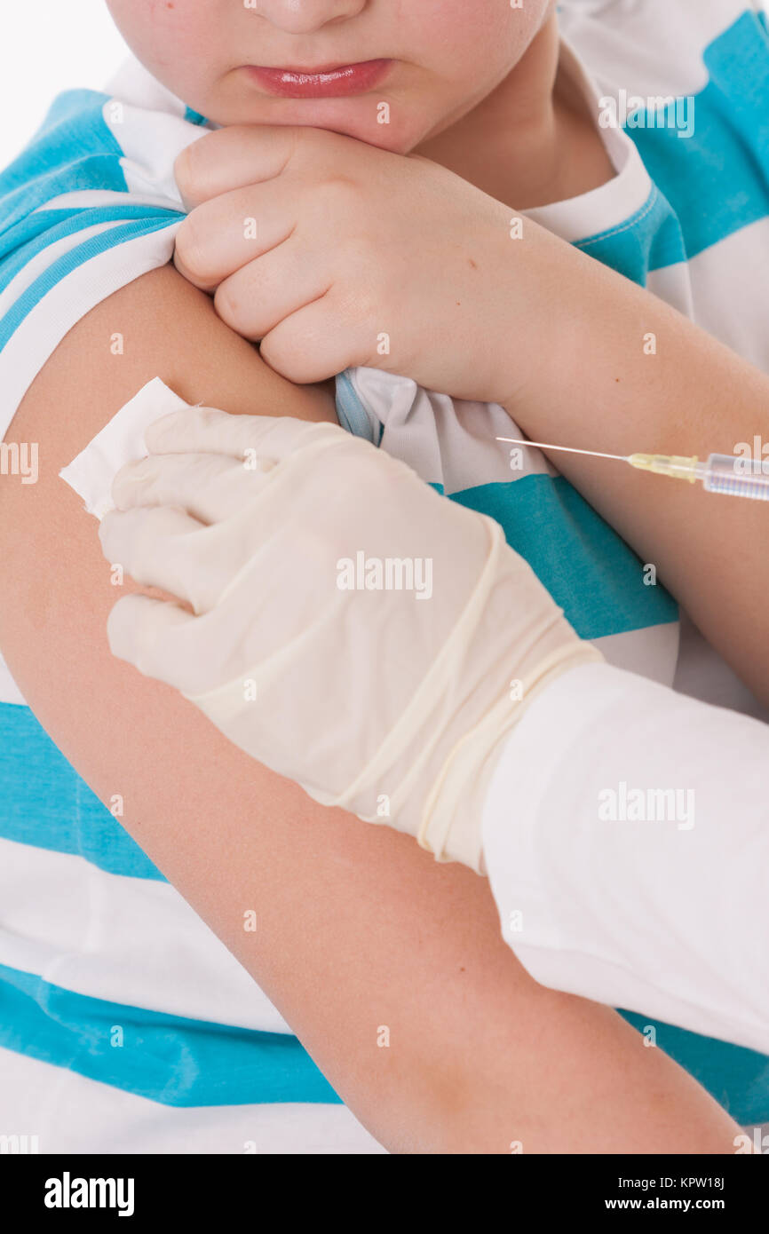 Doctor giving a child injection in arm on isolated image Stock Photo ...