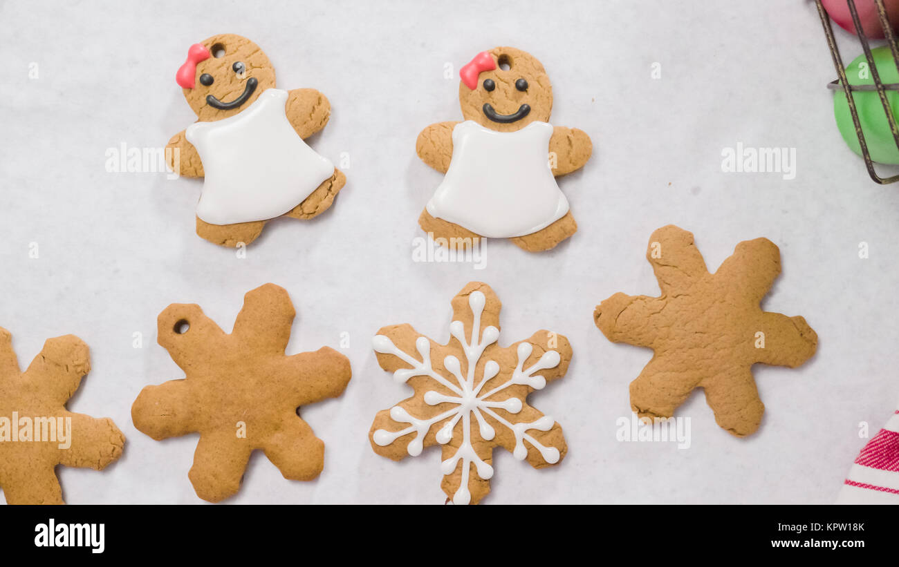 Decorating gingerbread cookies with royal icing for Christmas Stock ...