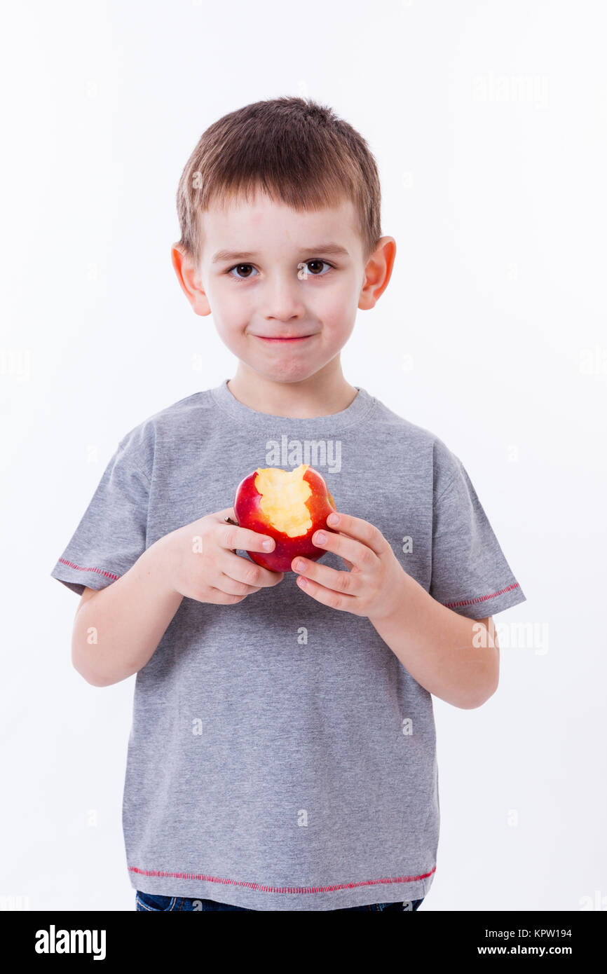 little boy with food isolated on white background - apple or a muffin ...