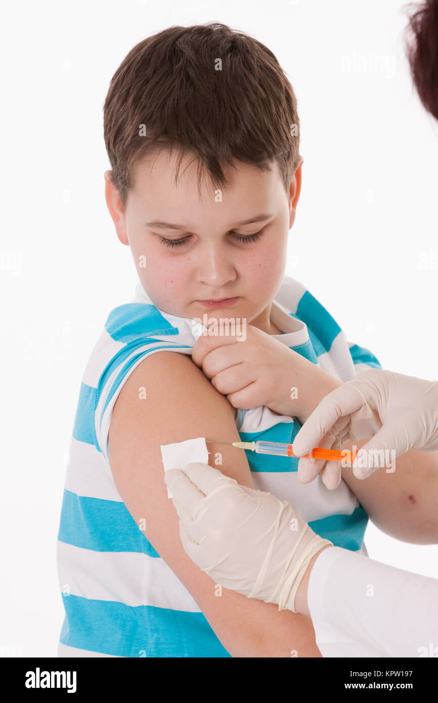Doctor giving a child injection in arm on isolated image Stock Photo ...