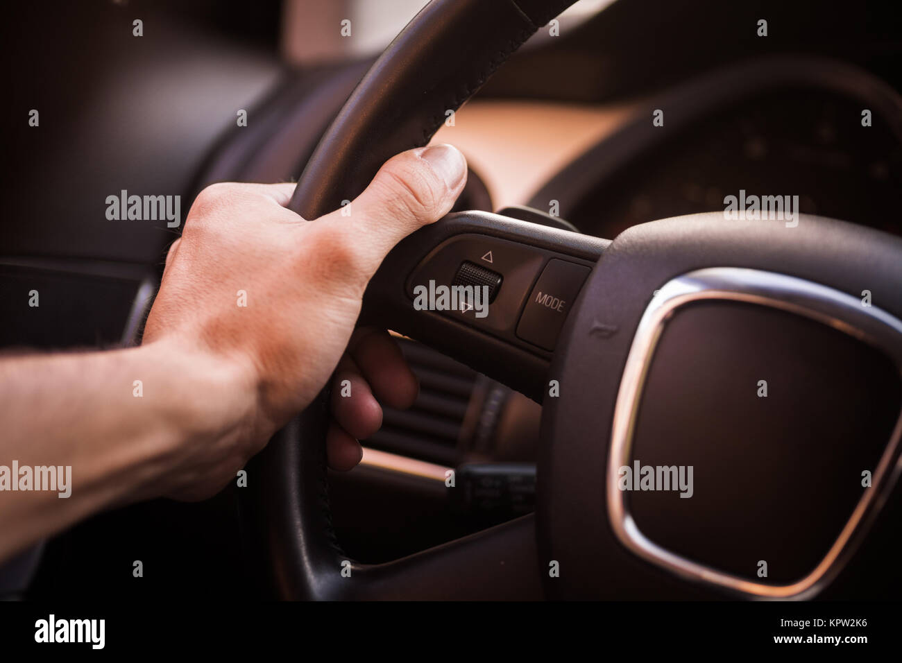 Hands on steering wheel Stock Photo - Alamy