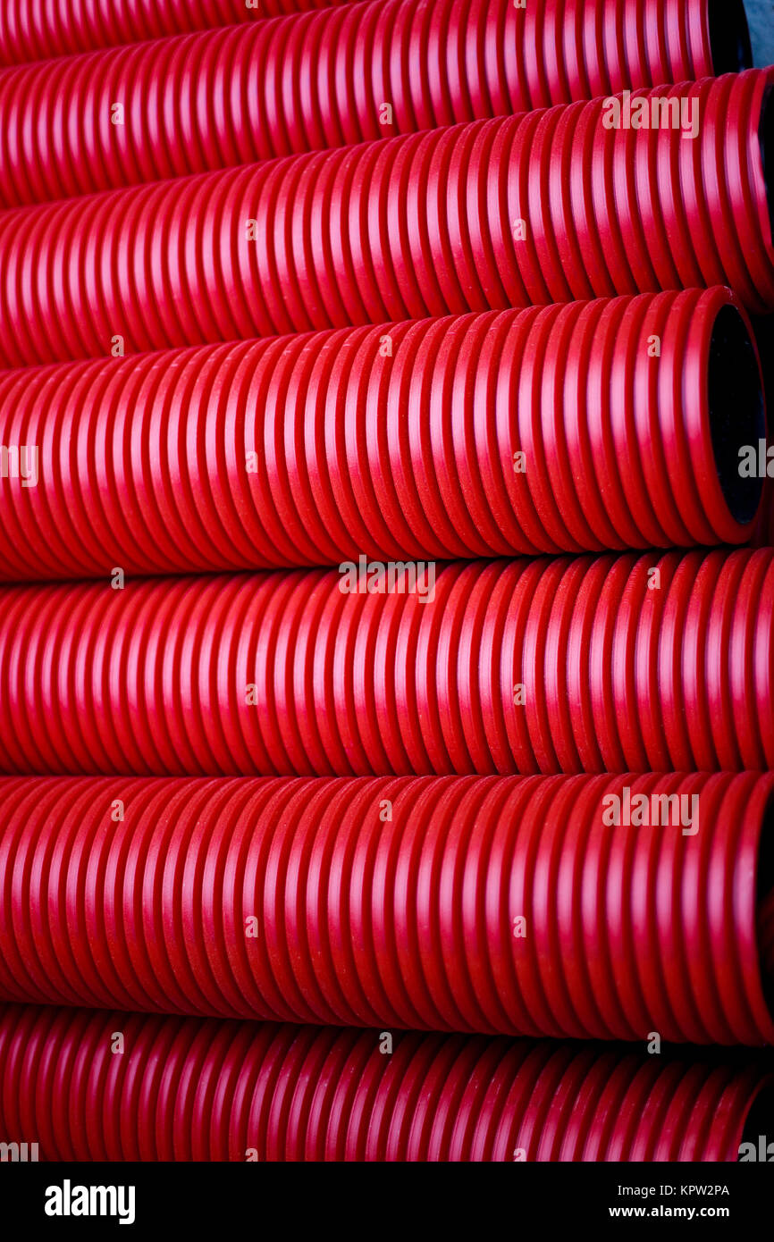 Red plastic pipes Stock Photo - Alamy