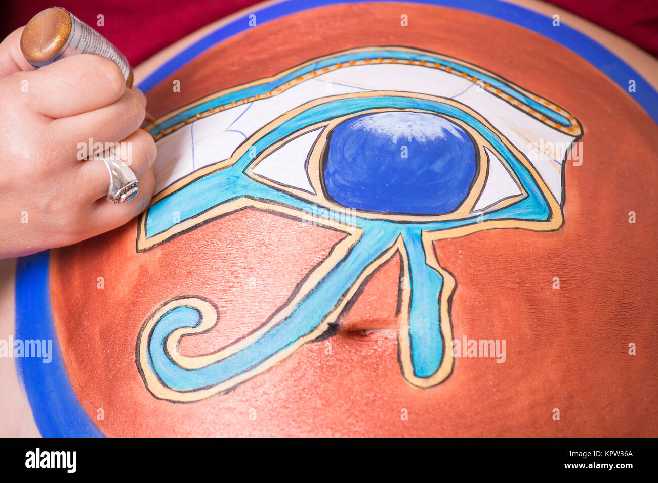 Egyptian symbol in pregnant belly Stock Photo - Alamy
