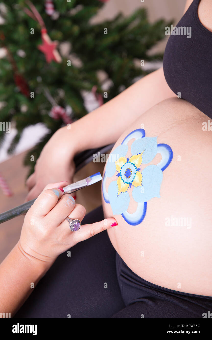 Mandala Belly Painting in Christmas Stock Photo - Alamy