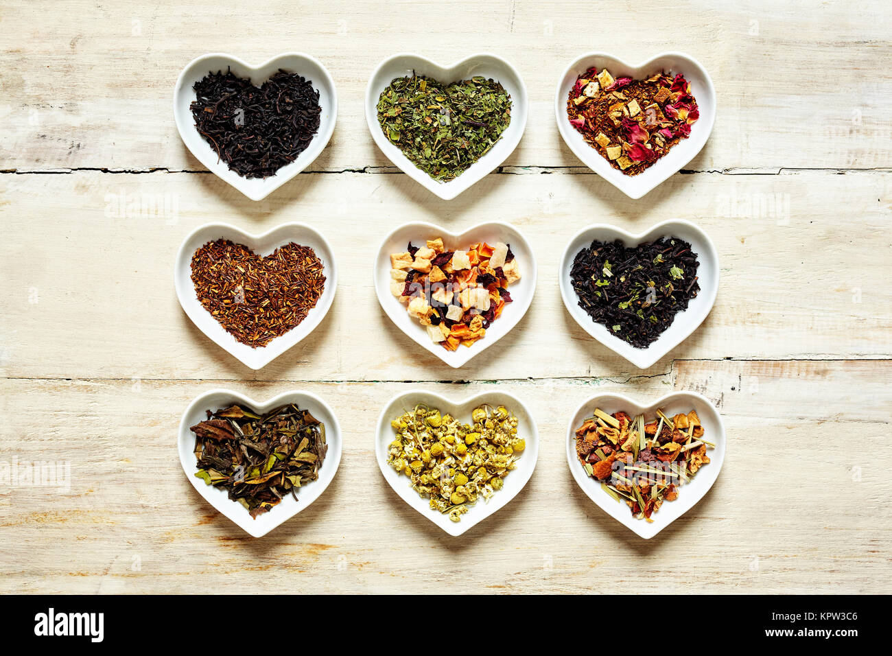 Top down view on nine colorful mild and spicy culinary tea sorts filled ...