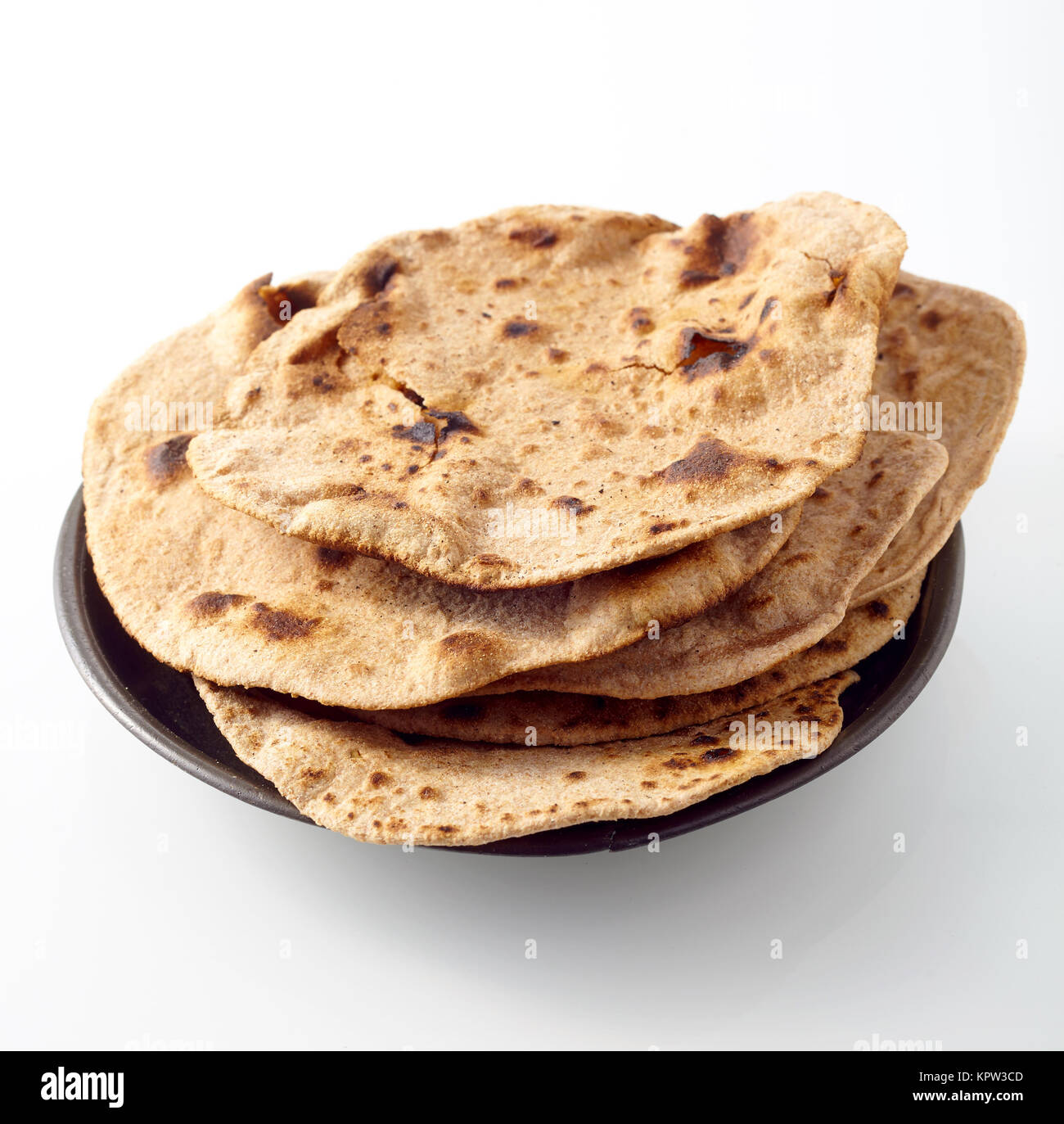 Short stack of toasted indian flat chapati bread displayed in a small ...
