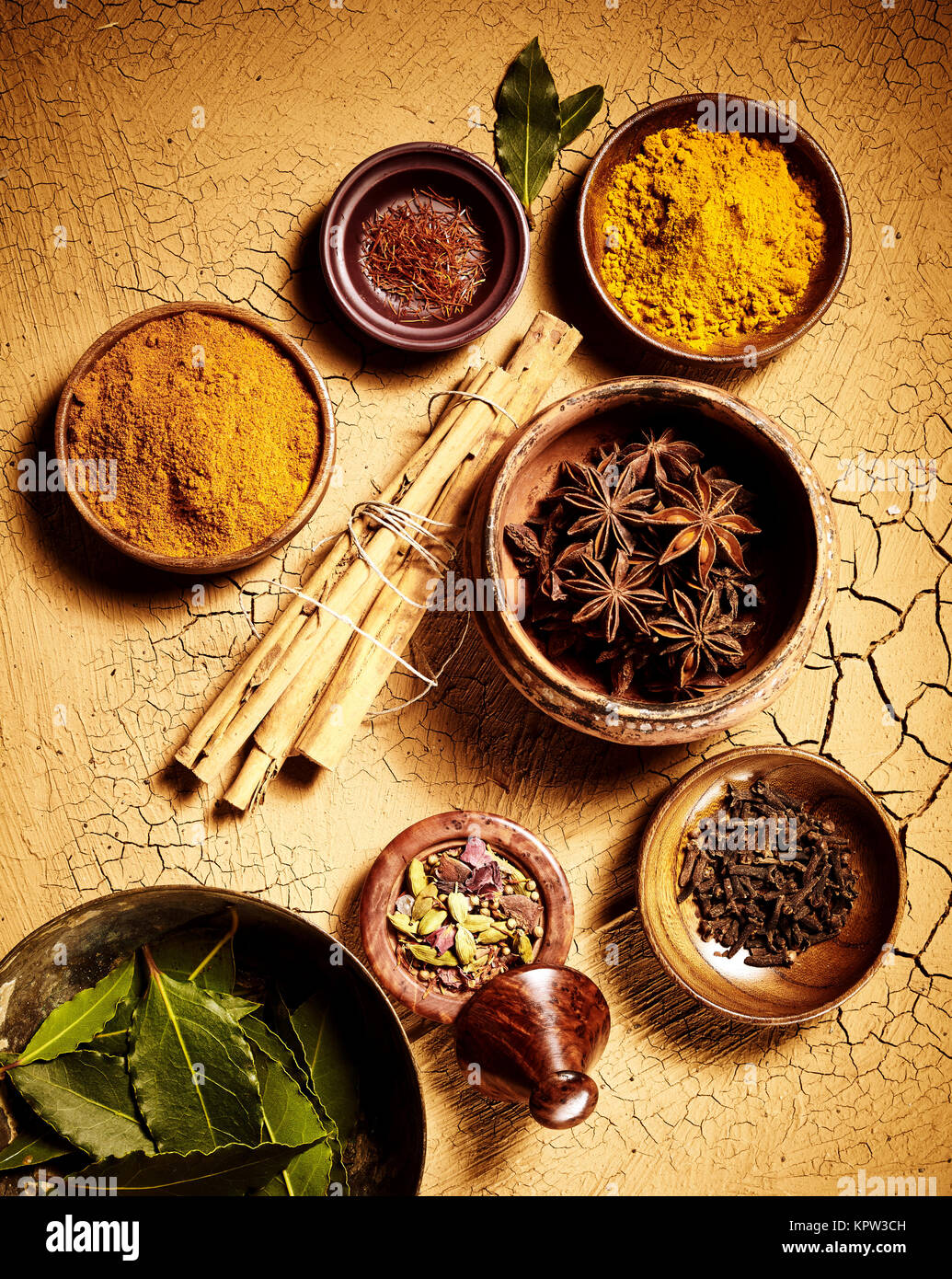 Above view on pots of assorted whole leaf and ground herbs and spices ...